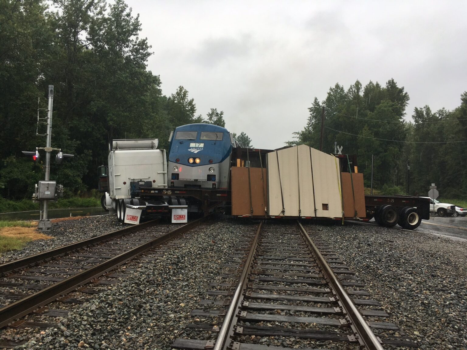 Amtrak hits tractor trailer stalled on railroad tracks