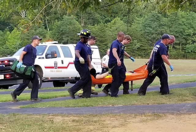 Fire and rescue crews rescue man in ravine behind elementary school